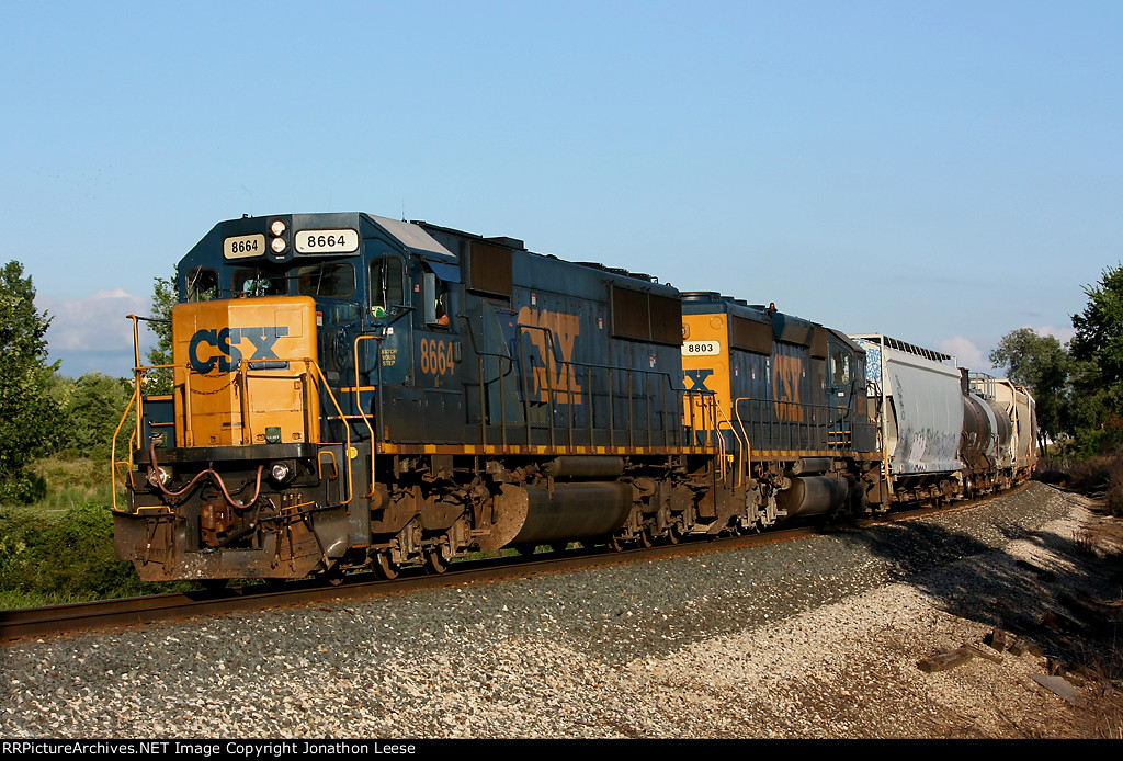 CSX 8664 and 8803 lead Q335 west into Grand Rapids